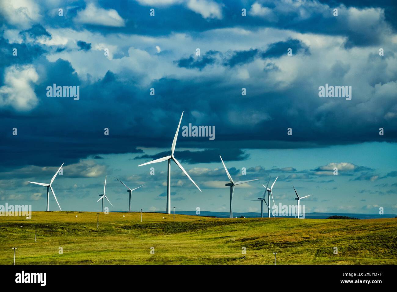 Windmills / wind turbines in a remote British hilly landscape. Moody ...