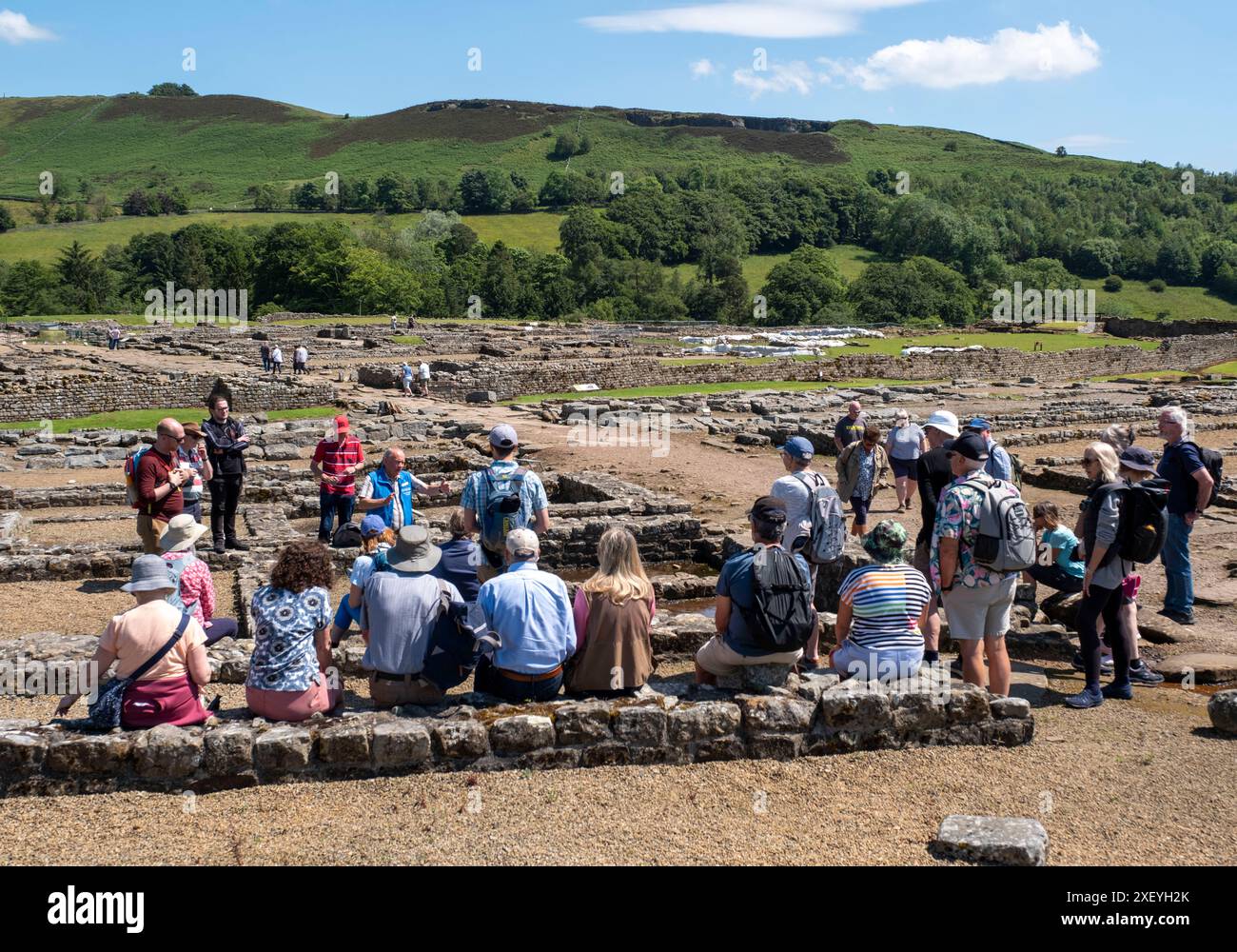 Vindolanda tour guide taking visitors around the Vindolanda Roman Fort ...