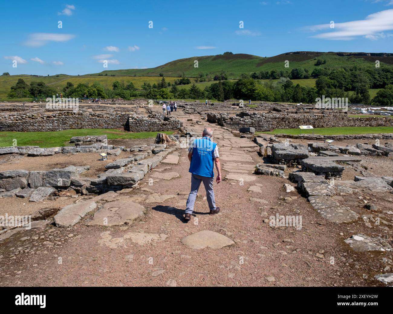 Vindolanda tour guide taking visitors around the Vindolanda Roman Fort ...