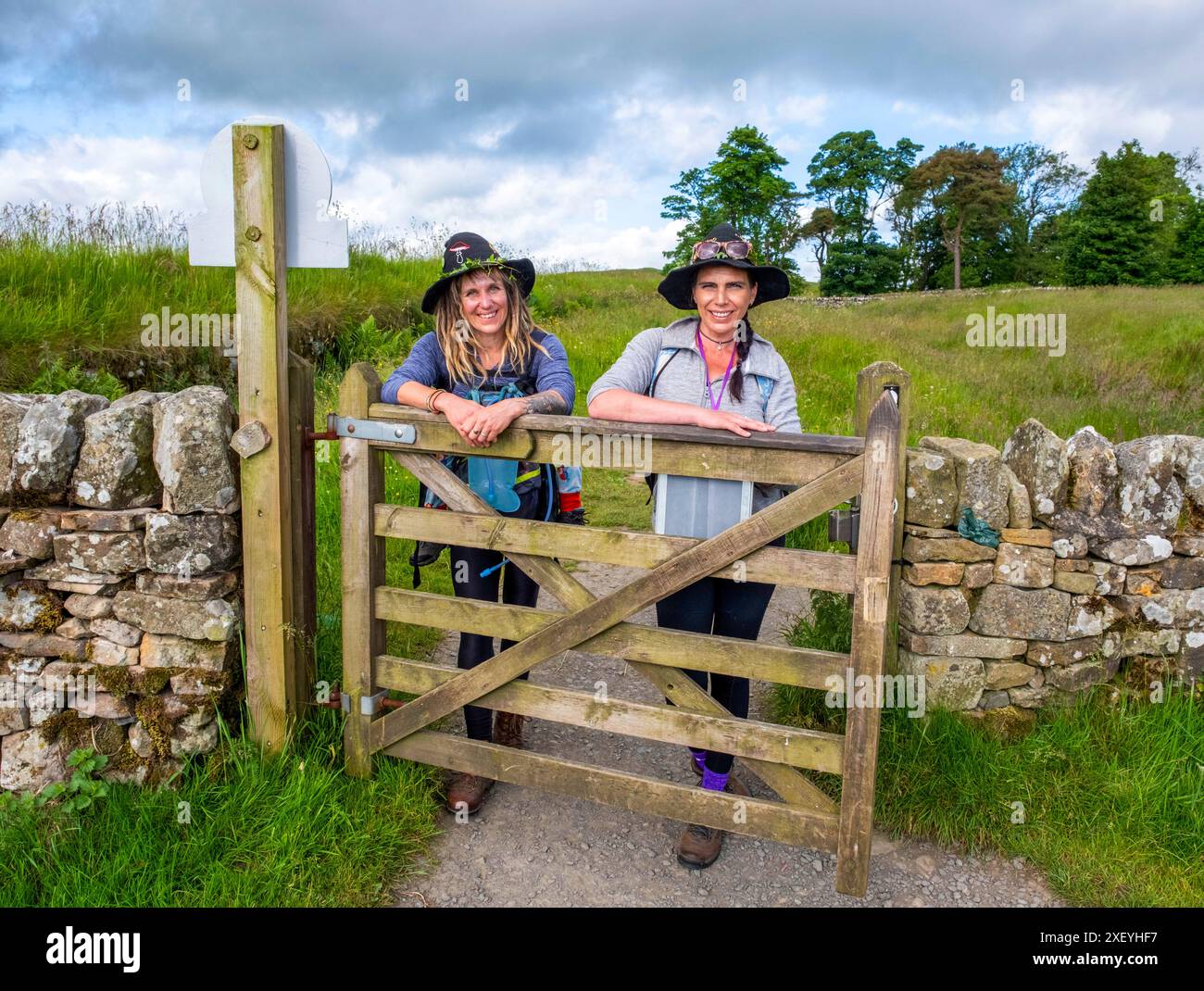 Two ladies wearing witches hats on pose for a picture at Steel Rigg ...