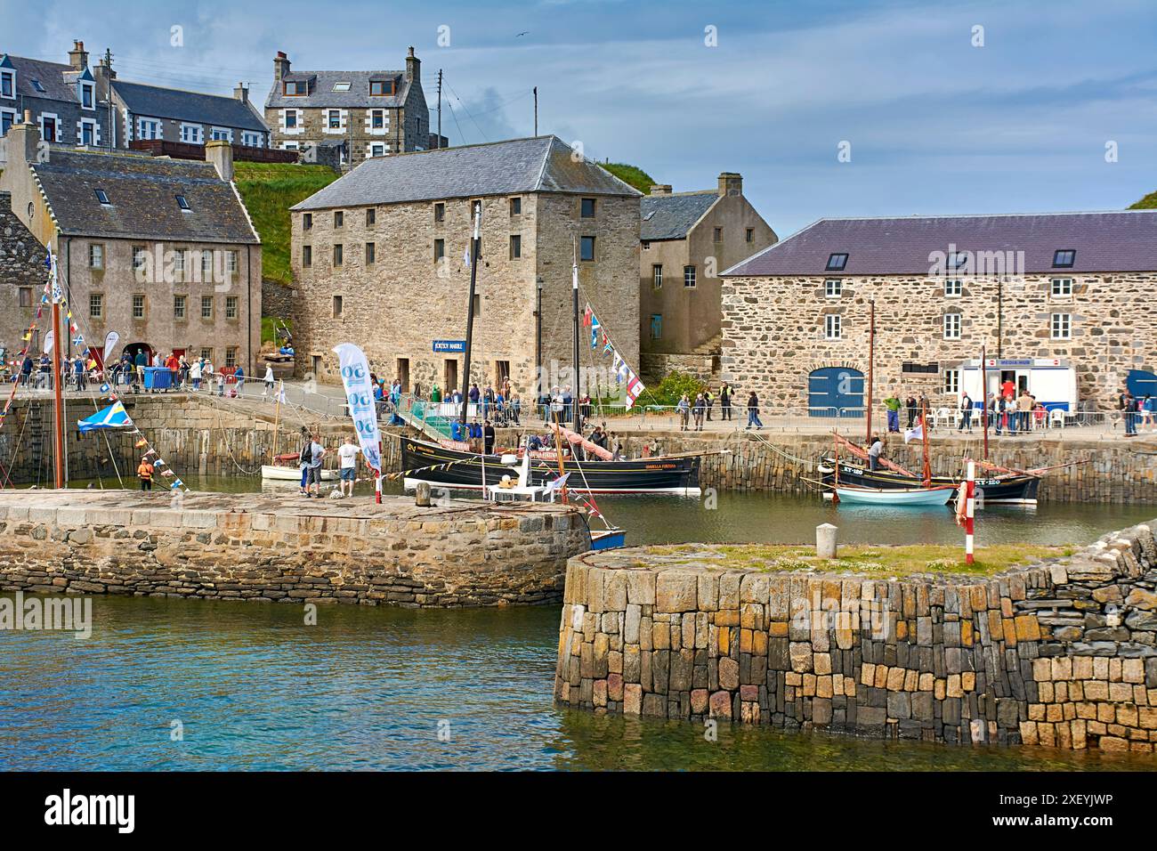 Portsoy Boat Festival the old harbour houses stone walls and moored ...