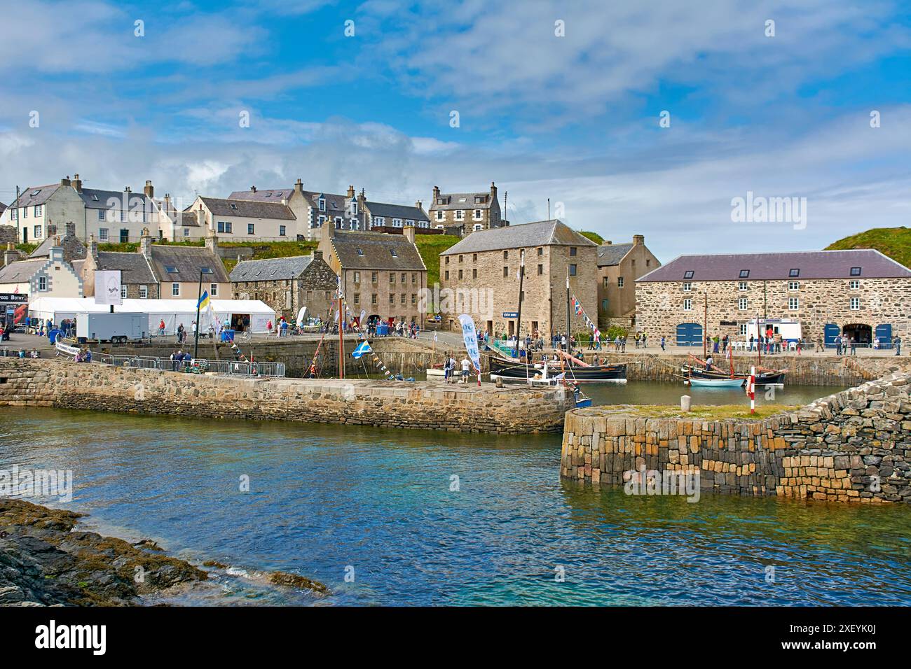 Portsoy Boat Festival the old harbour the houses stone walls and moored ...