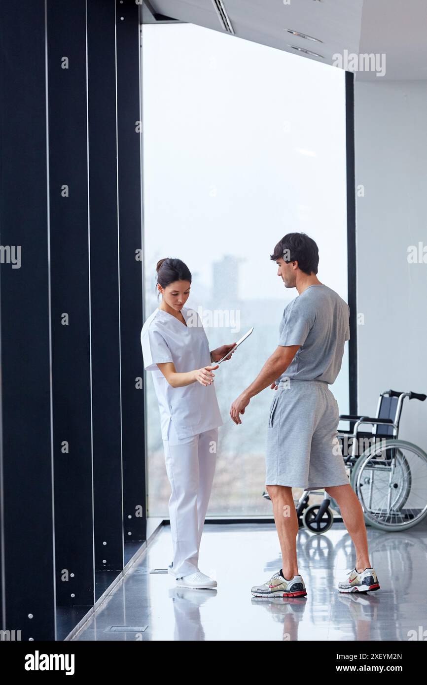 Physical therapist helping a patient to walk Stock Photo - Alamy