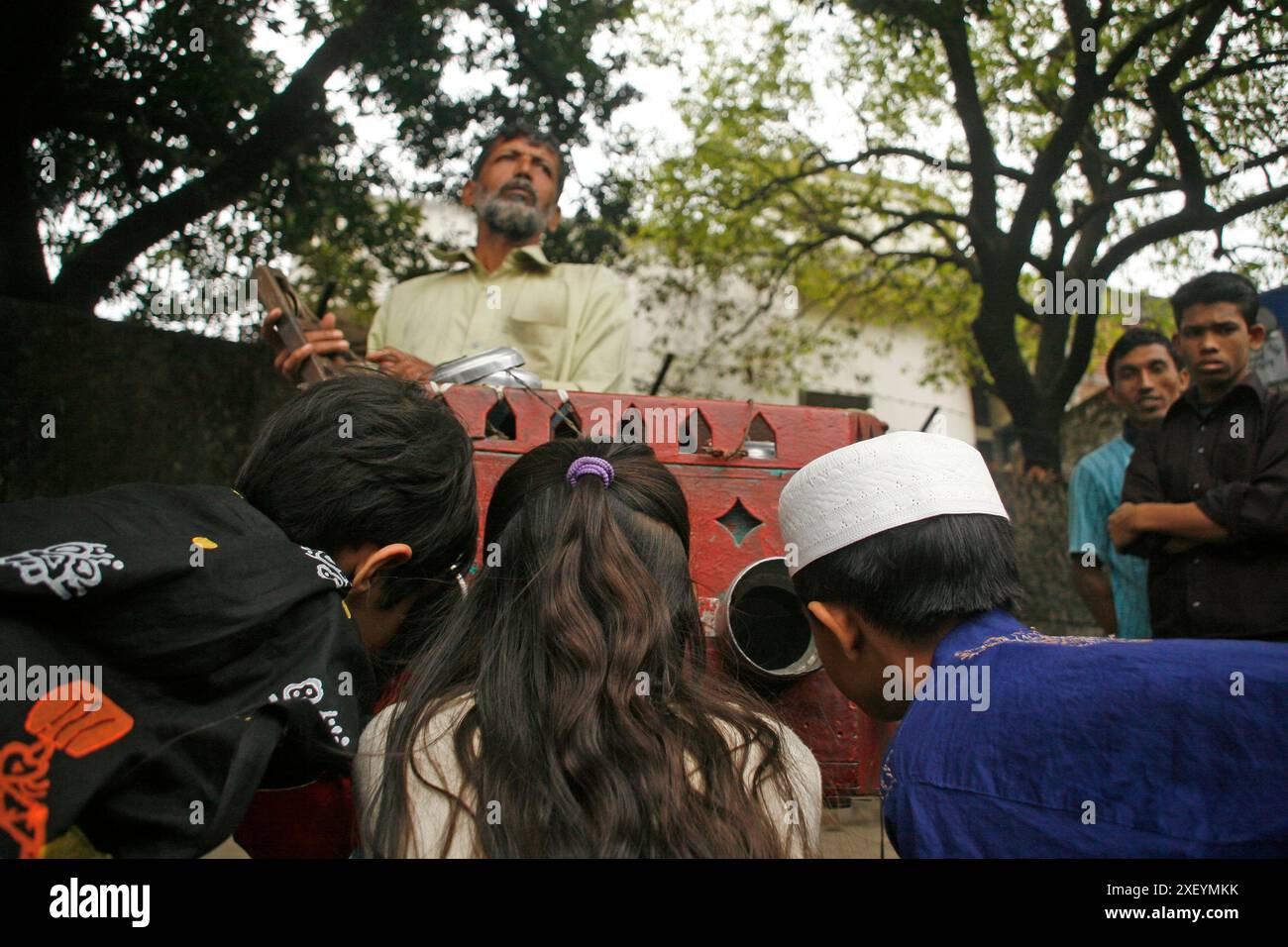 Children watching "Still Movie” or bioscope at Azimpur, Dhaka ...