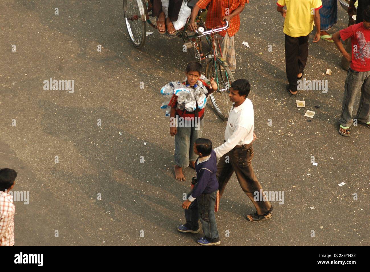 A street child make his way through a city street, Dhaka, Bangladesh ...