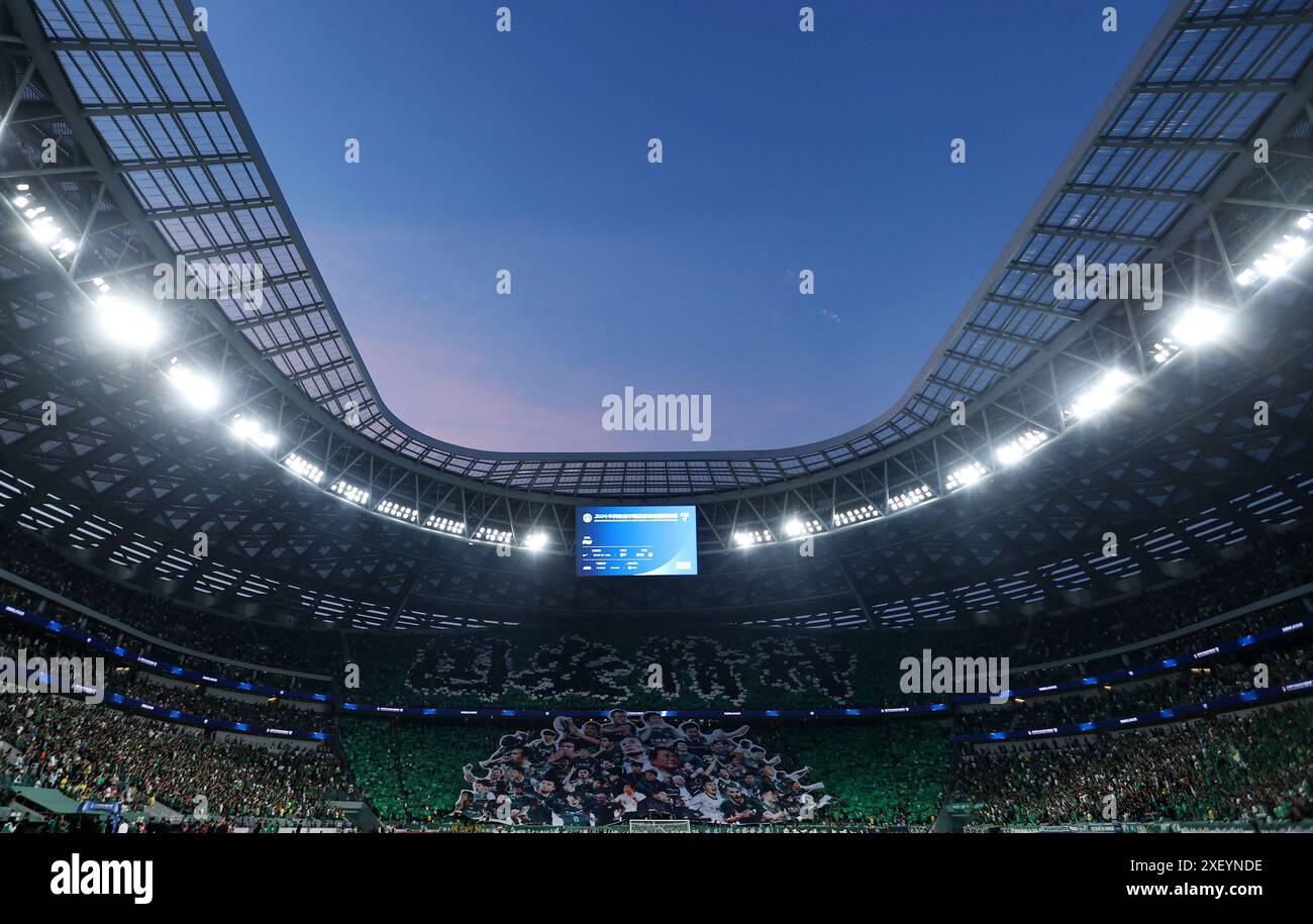 Beijing, China. 30th June, 2024. Beijing Guoan supporters display a ...