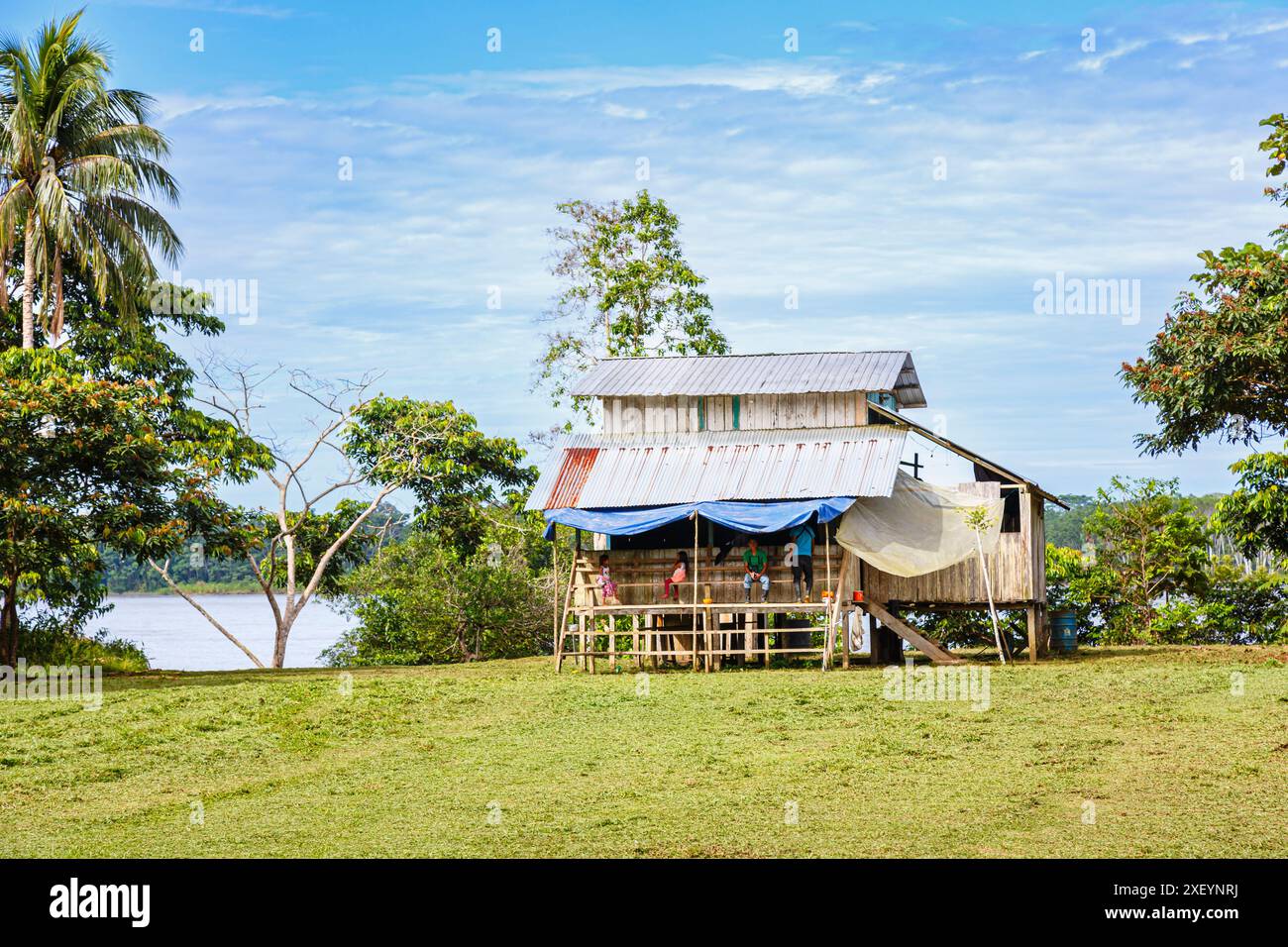 Typical wooden communal residential building on stilts in the remote ...