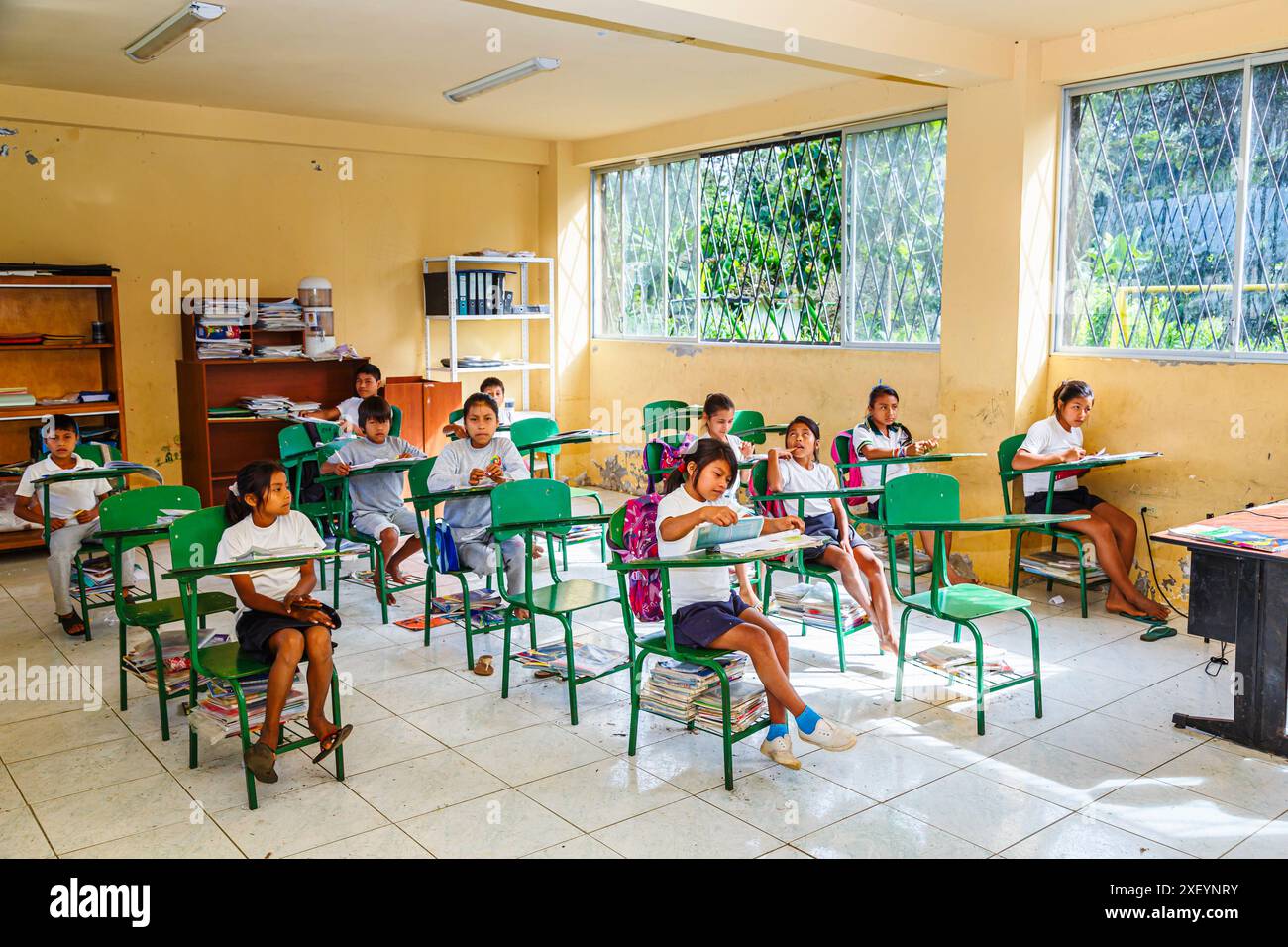 Local children learning in a school classroom in the Pilchi Community ...
