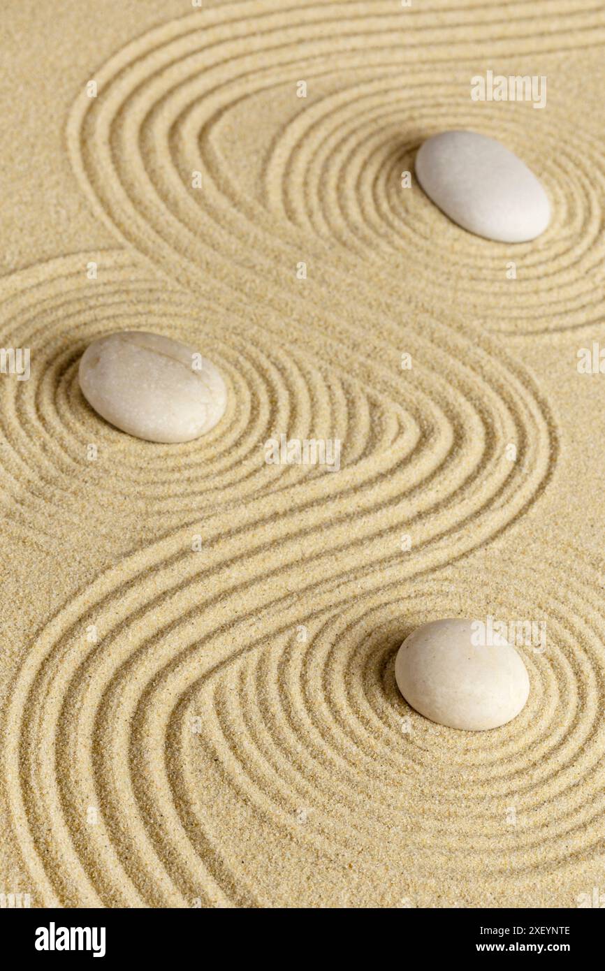 Zen garden with sand pattern and stones Stock Photo - Alamy