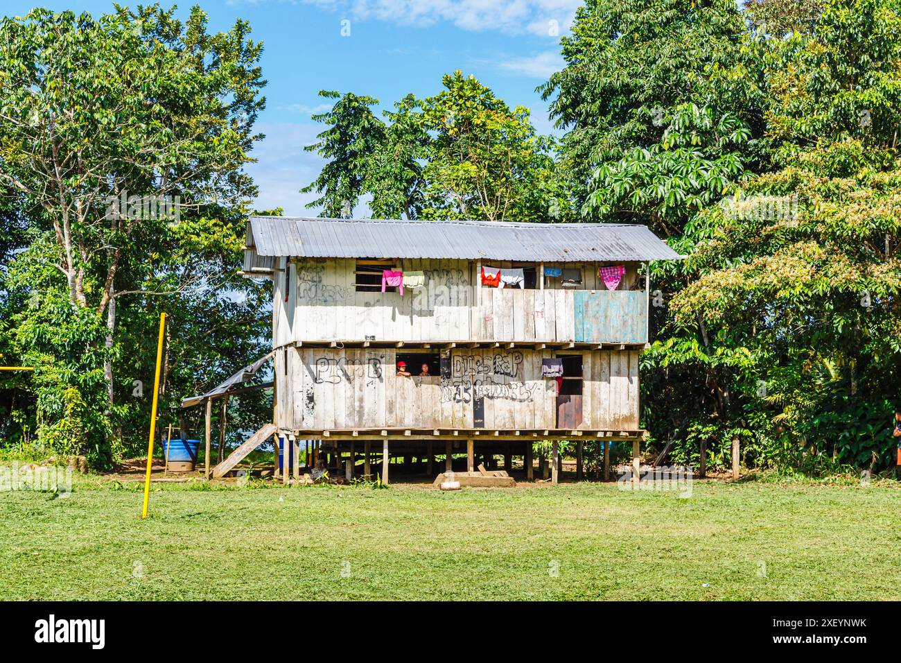 Typical wooden communal residential building on stilts in the remote ...