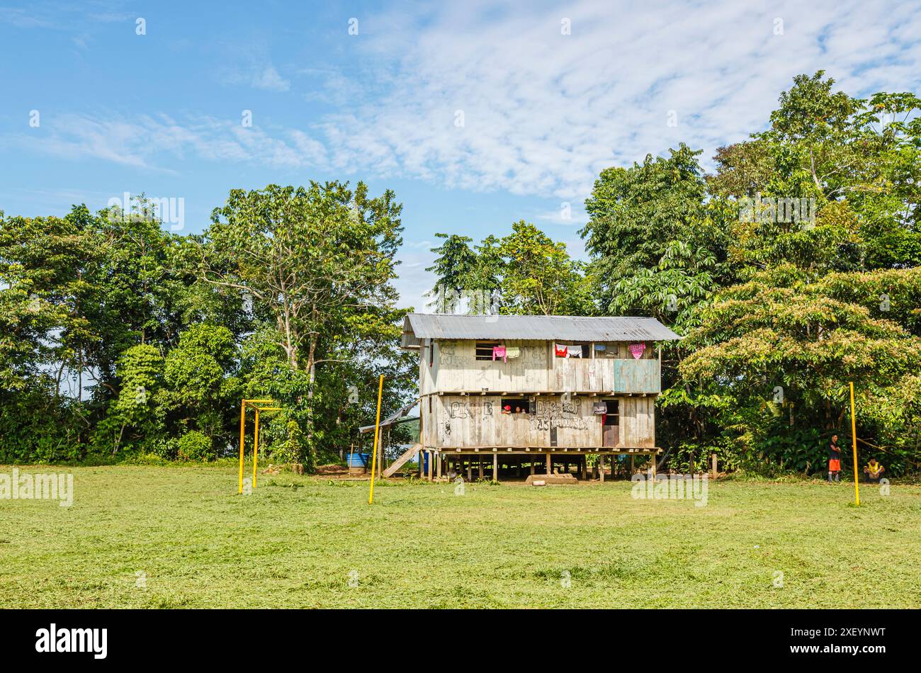 Typical wooden communal residential building on stilts in the remote ...