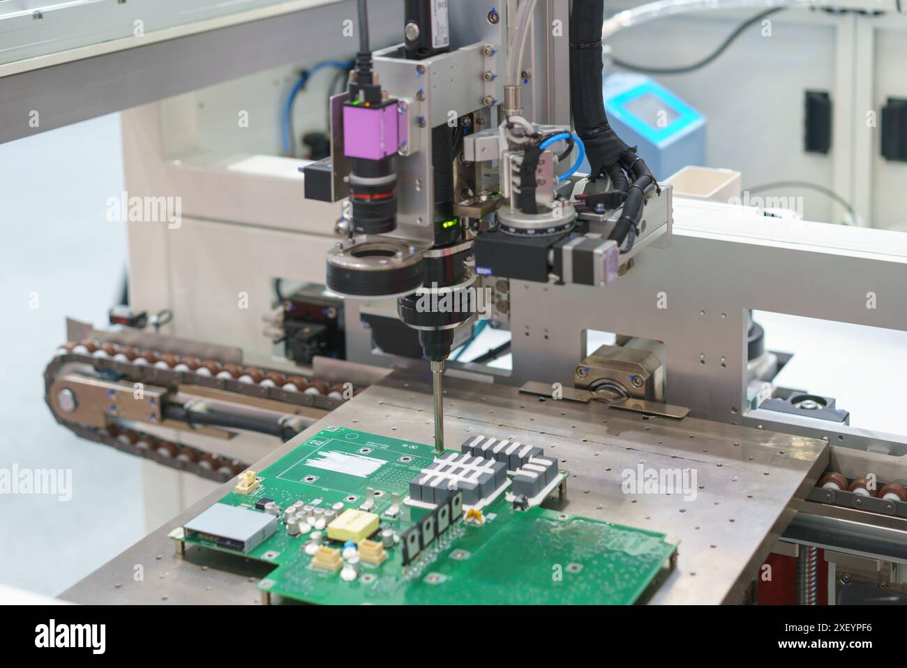 automated machine assembling a circuit board, reflecting the precision ...