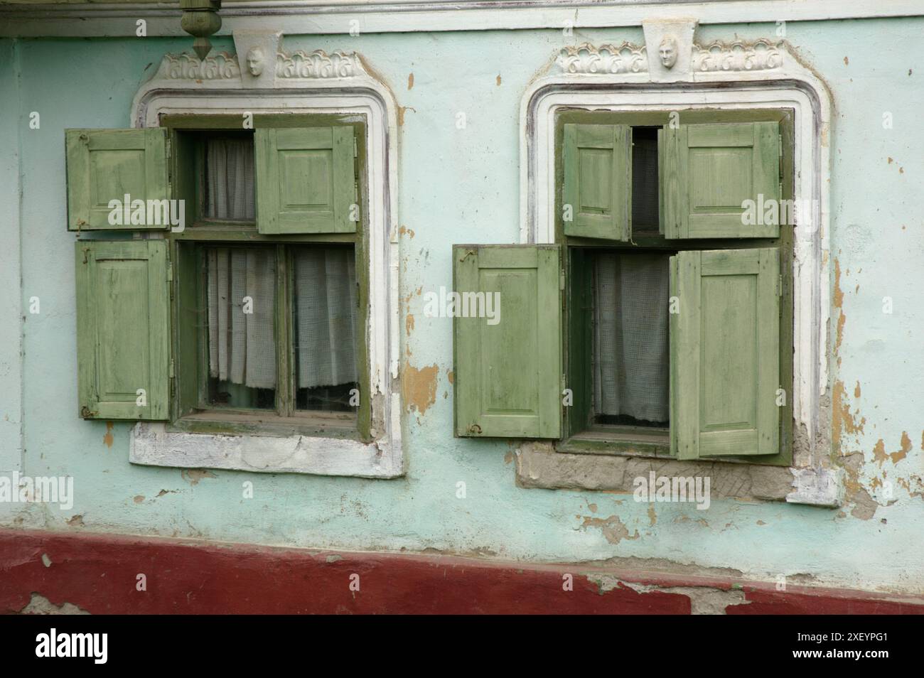 Rustic windows with shutters on a house in Romania Stock Photo - Alamy