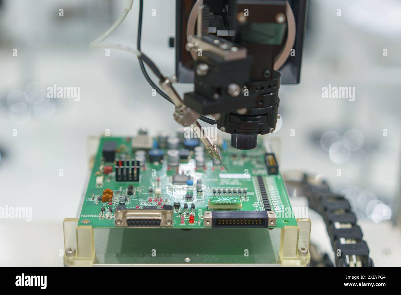 automated Printed Circuit Board (PCB) assembly machine in action ...
