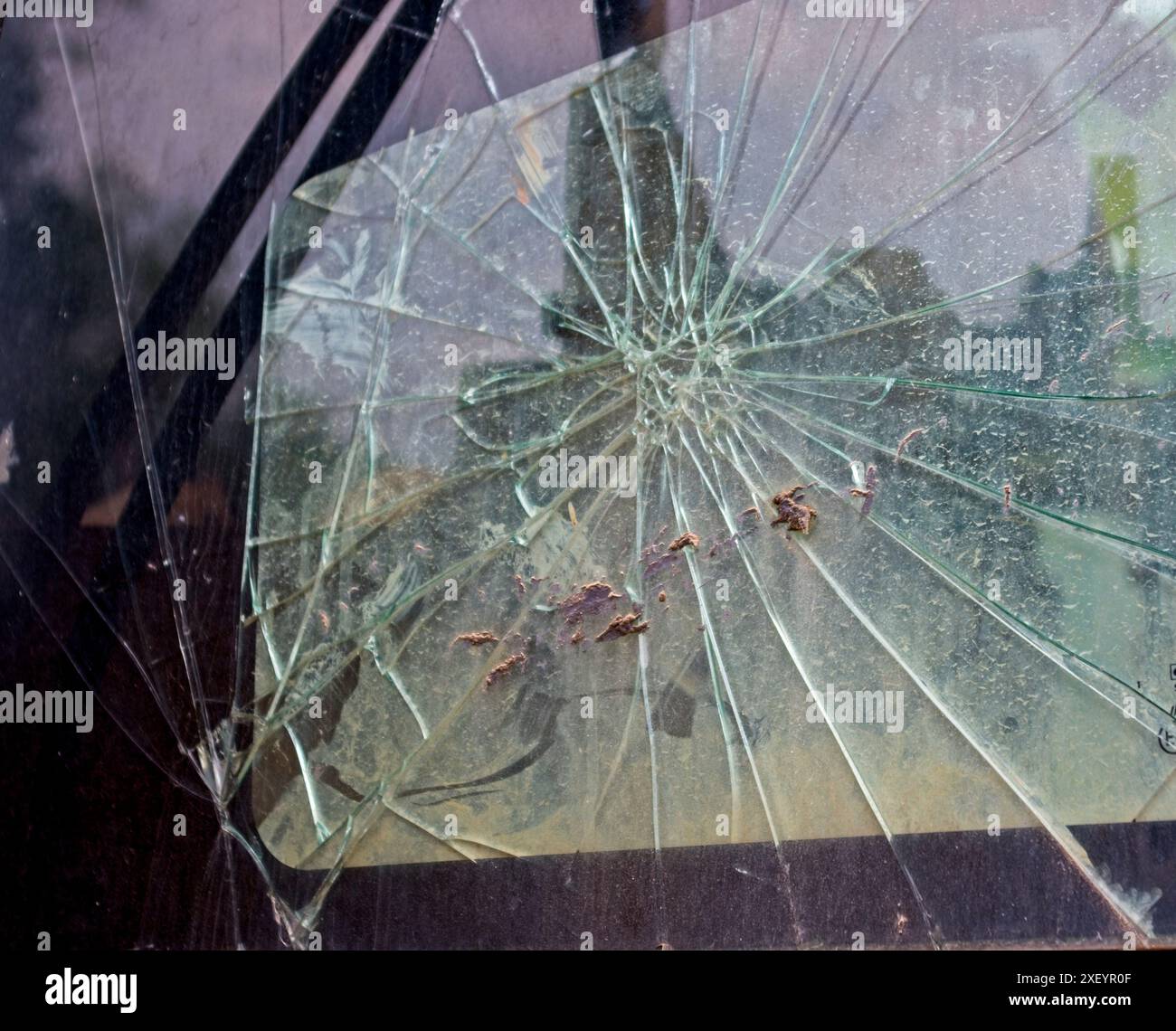 Dirty pane of glass shattered with bits of mud Stock Photo - Alamy