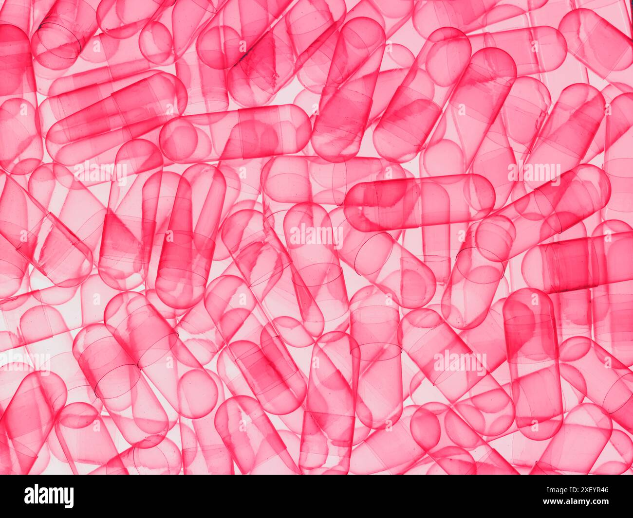 Empty clear red capsules Stock Photo - Alamy
