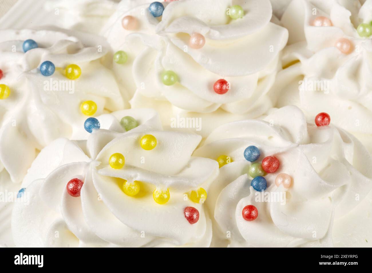 Whipped cream with the colorful sprinkles Stock Photo - Alamy