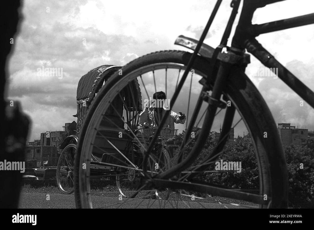 A rickshaw puller talks to his nearest one by mobile phone, Dhaka ...