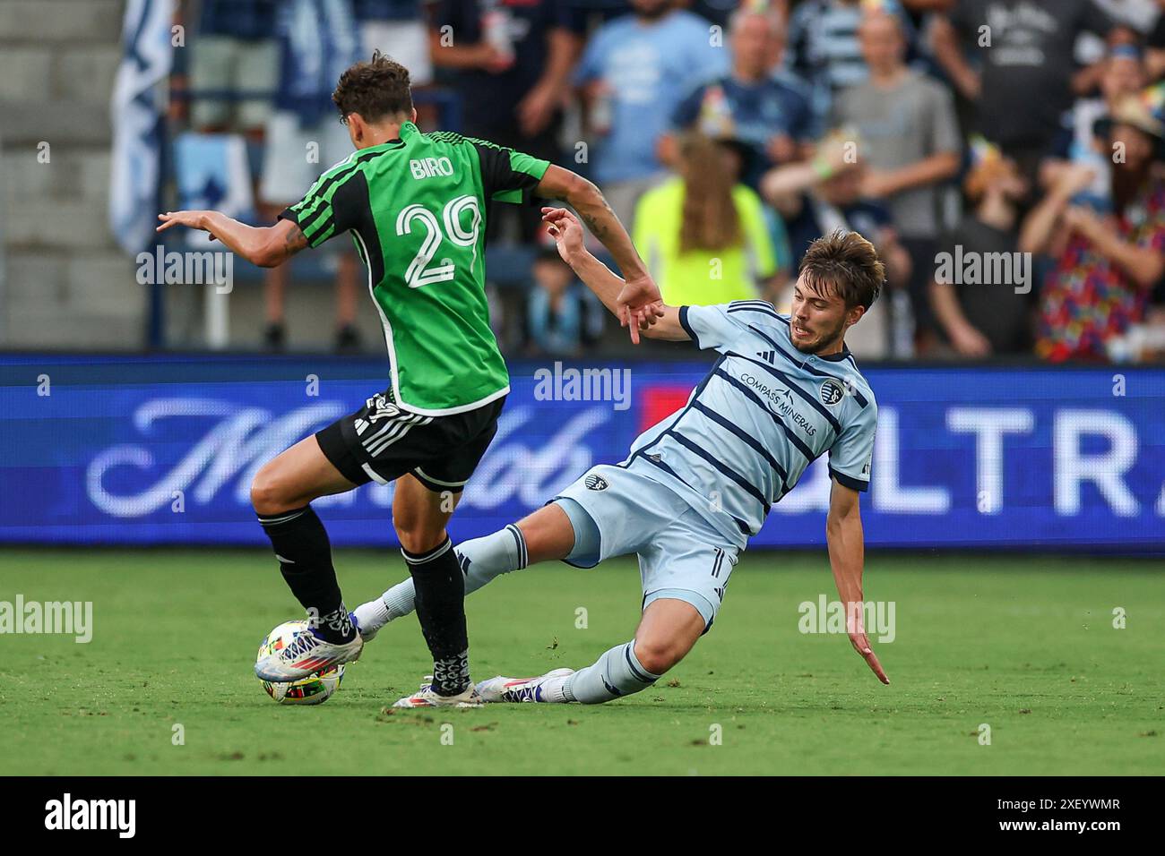 June 29, 2024:Sporting Kansas City defender Jake Davis (17) slides in ...