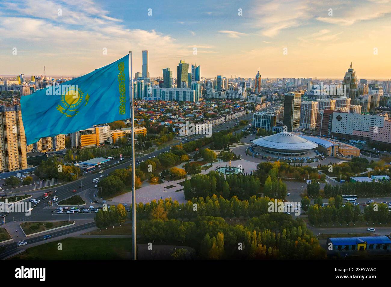 The Kazakhstan flag waiving above Astana city, with the panorama view ...