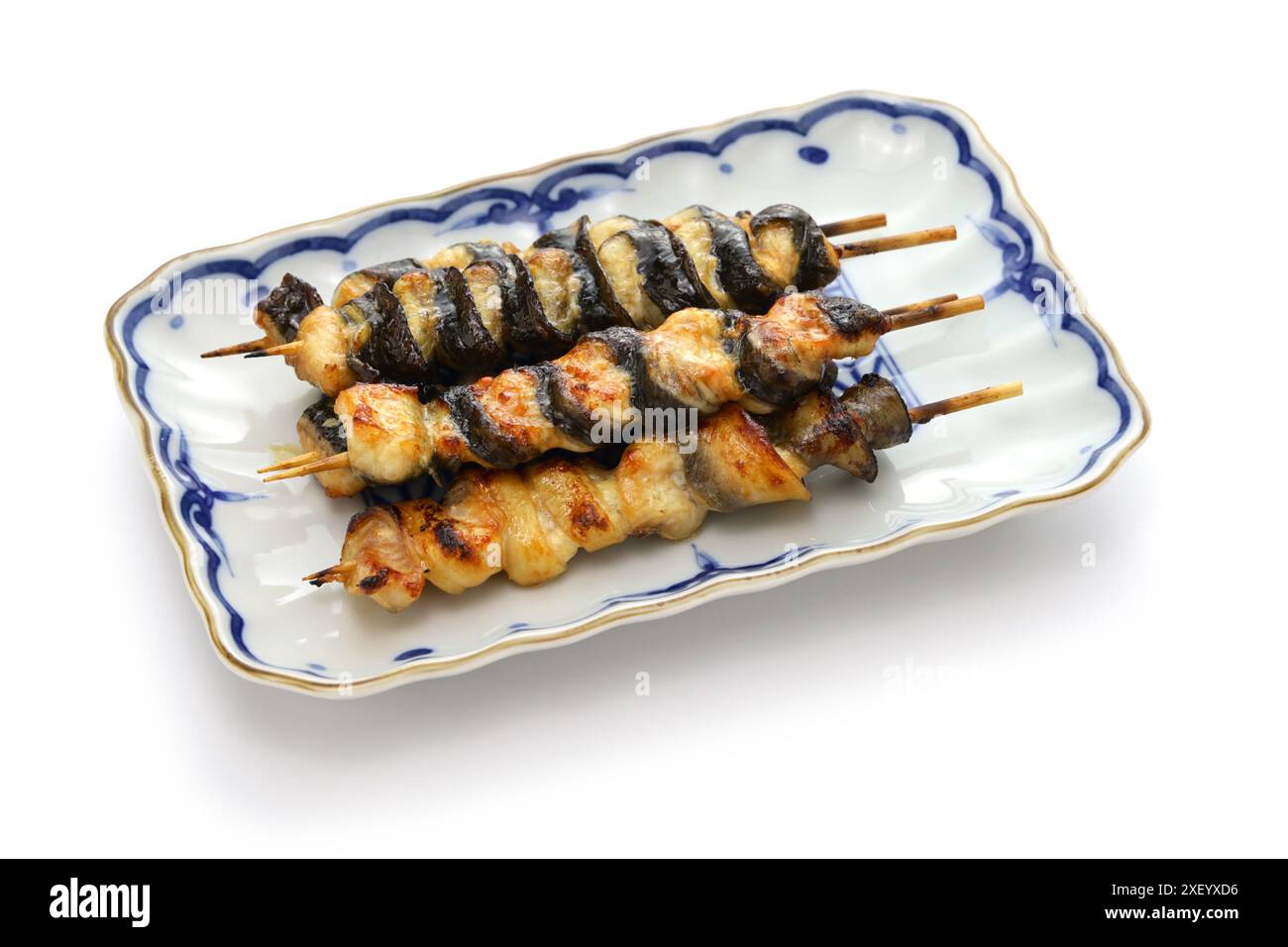 Kurikara-yaki (charcoal grilled eel skewers), Japanese unagi dish isolated on white background ...