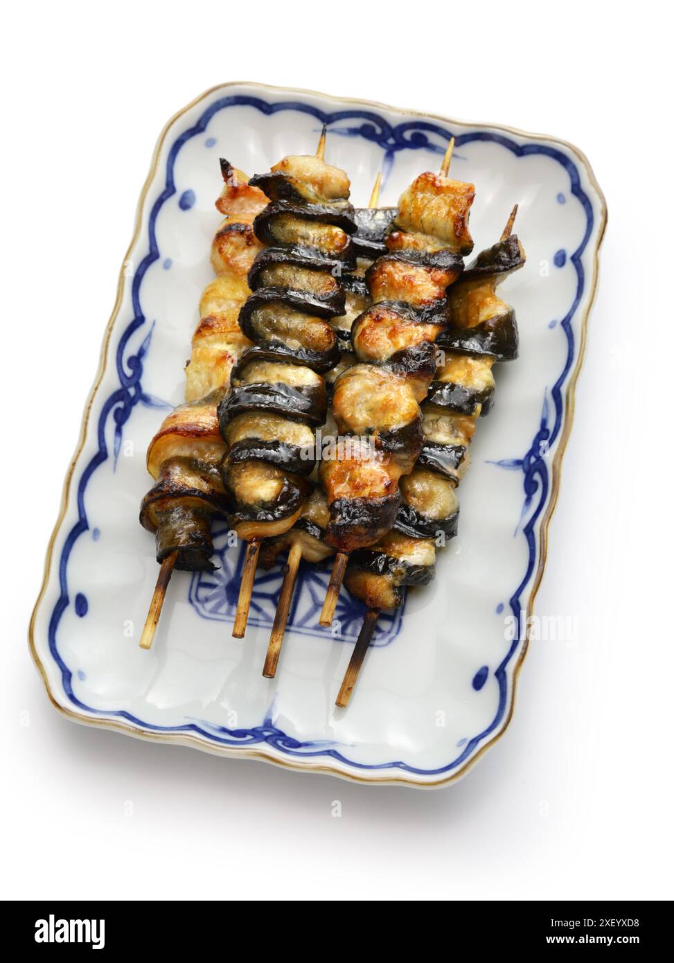 Kurikara-yaki (charcoal grilled eel skewers), Japanese unagi dish isolated on white background ...
