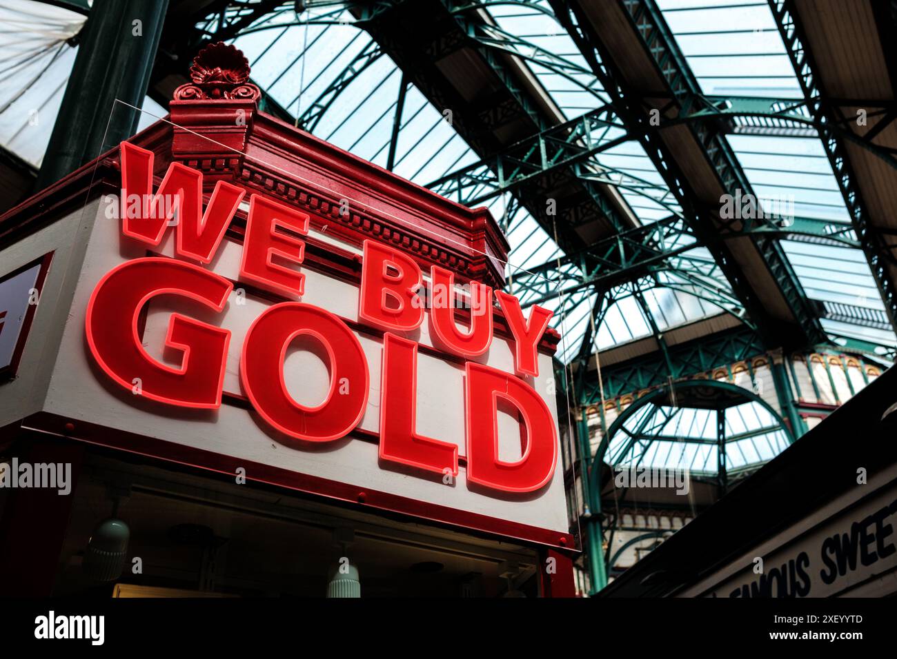 Leeds England: 3rd June 2024: A red We Buy Gold sign stands prominently ...