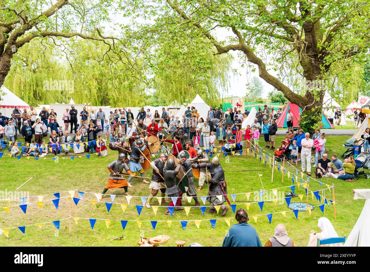 Mock battle with with two groups knights fighting each other in roped ...