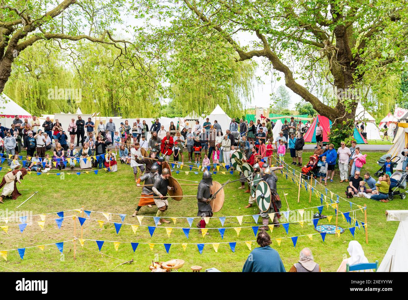 Mock battle with with two groups knights fighting each other in roped ...
