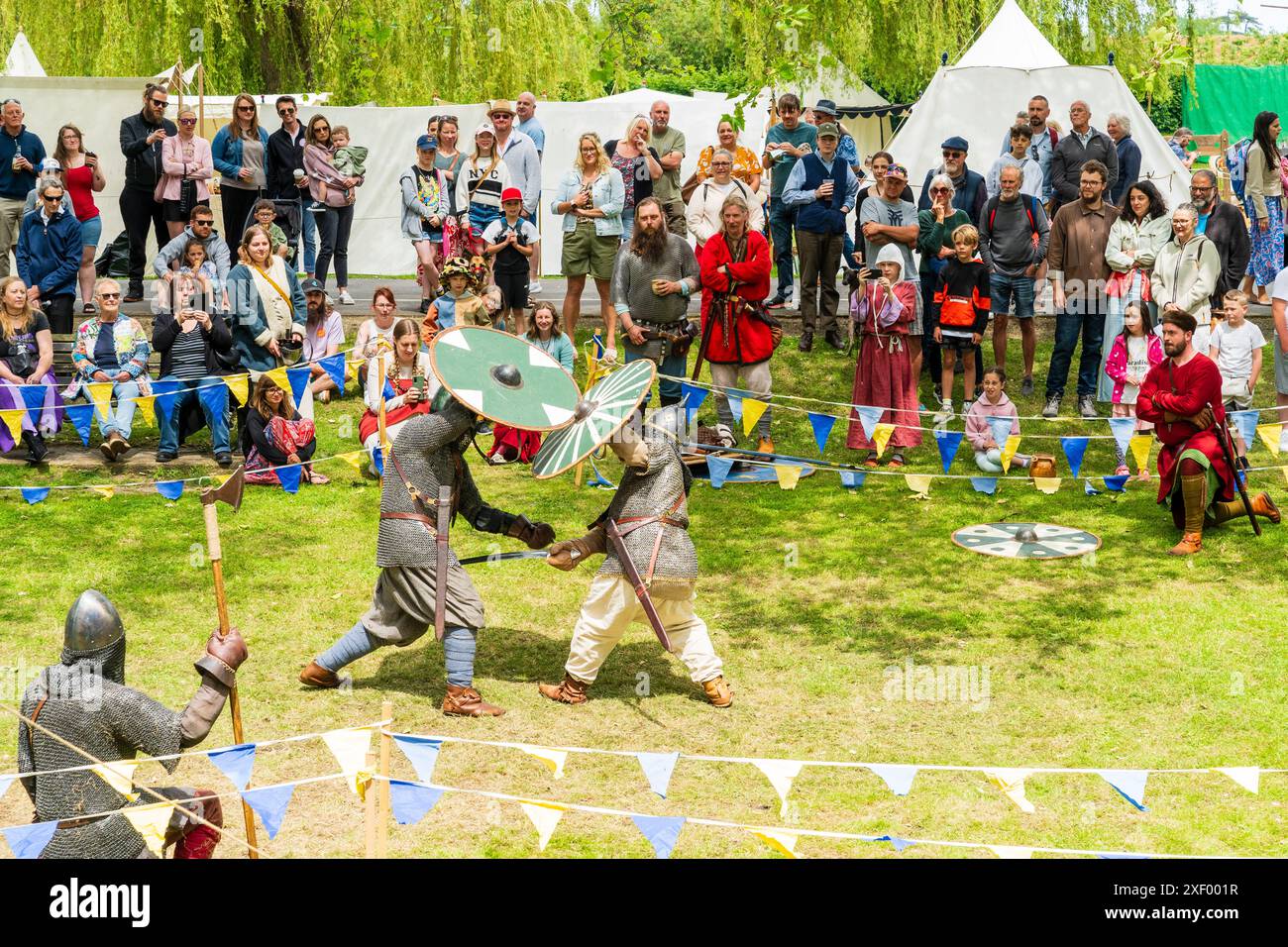 Mock battle with with two groups knights fighting each other in roped ...