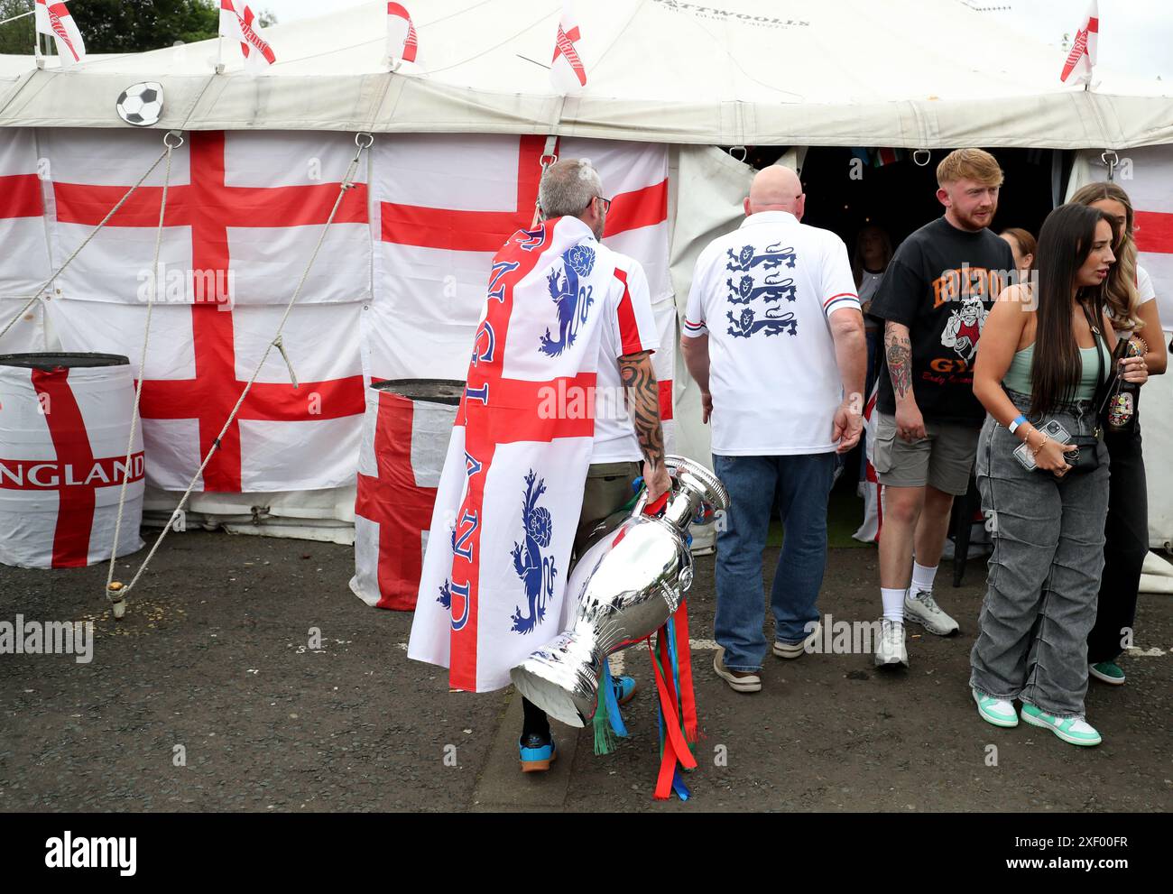 An England fan with a replica of the trophy at Dougie's Tavern in ...