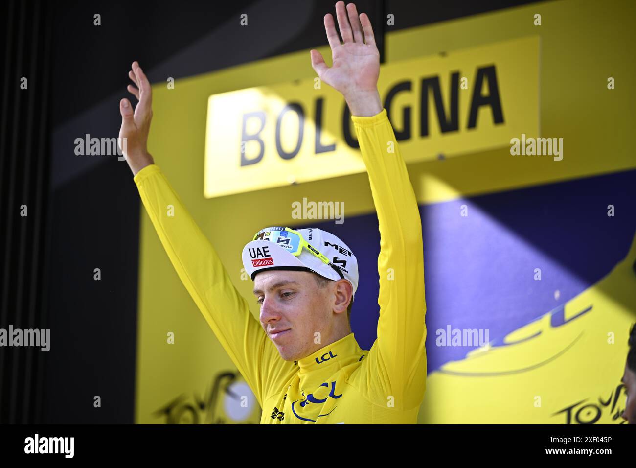 Slovenian Tadej Pogacar of UAE Team Emirates celebrates on the podium ...