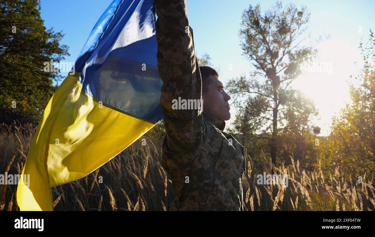 Male military lifted flag ukraine hi-res stock photography and images ...