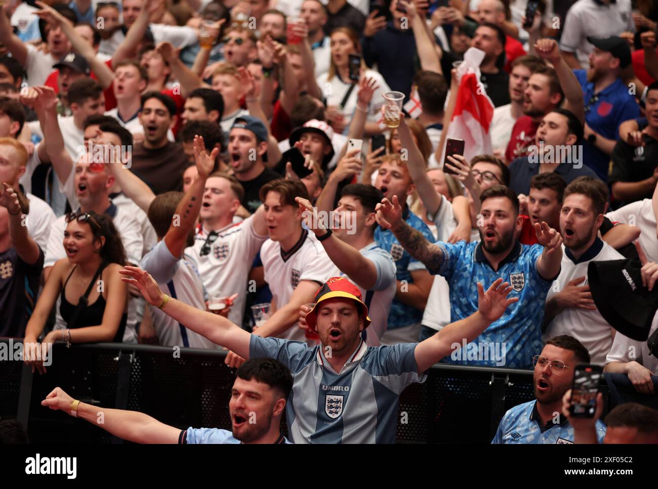 England fans sing the national anthem at BOXPark Wembley in London ...