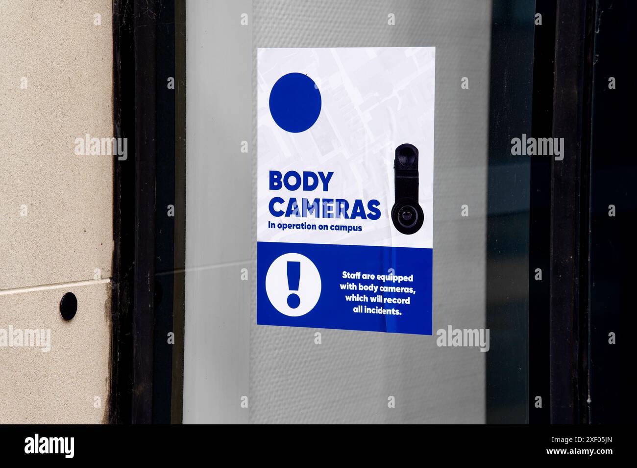 Body cameras in operation sign on university campus Stock Photo - Alamy