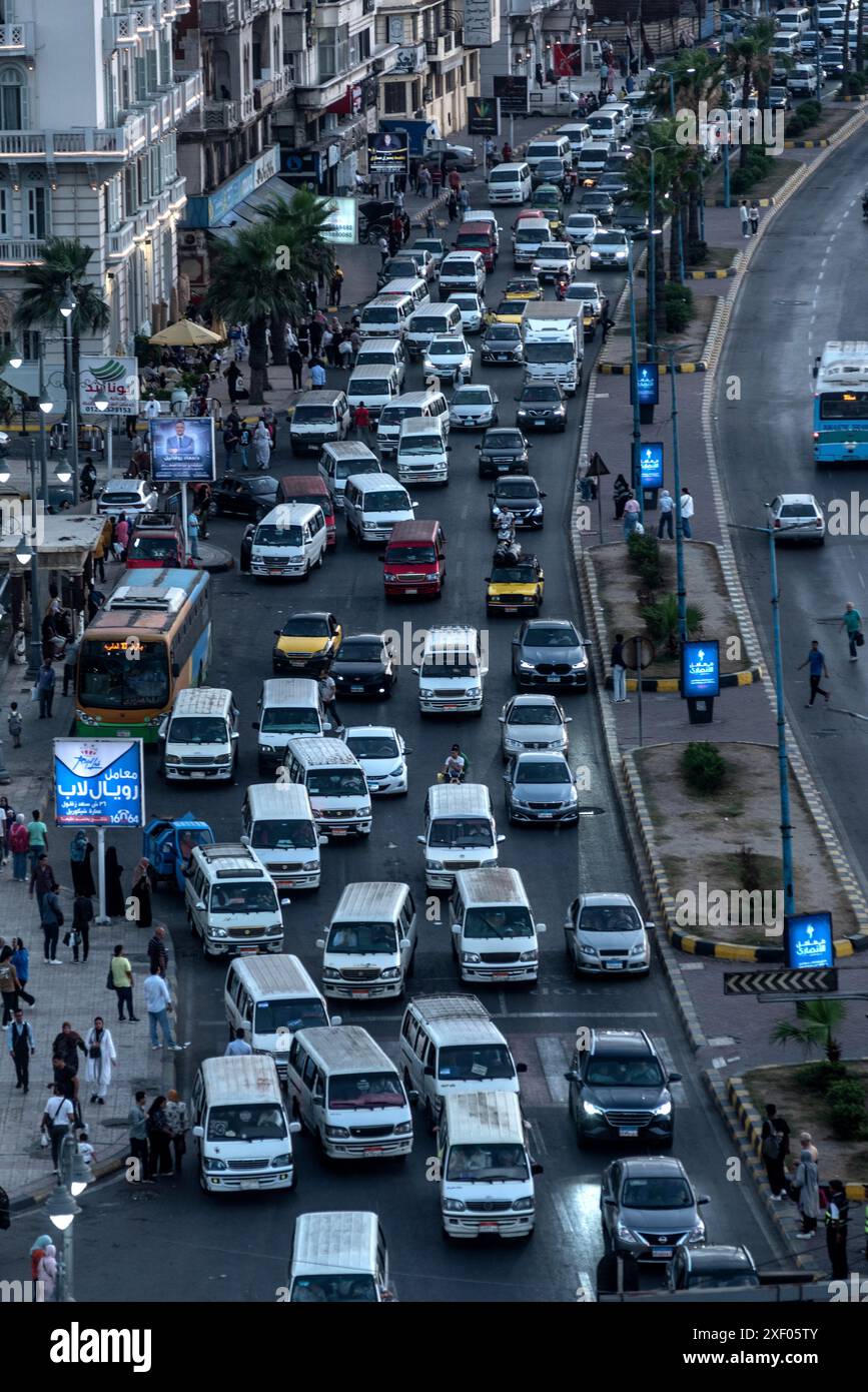 Busy traffic with lots of public mini buses along the Mediterranean Sea ...