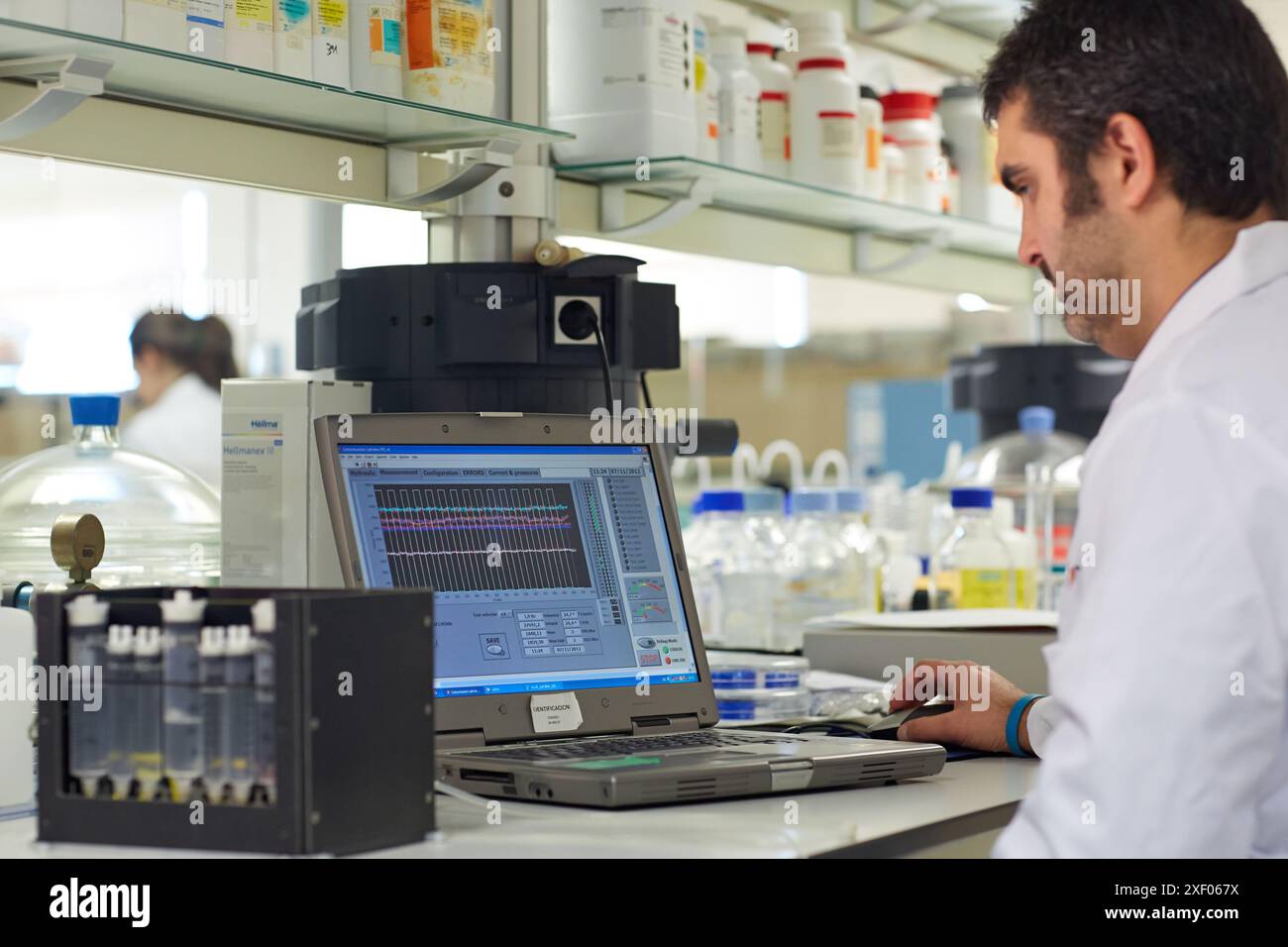 Researcher testing, Immune sensor based on fluorescence polarization ...