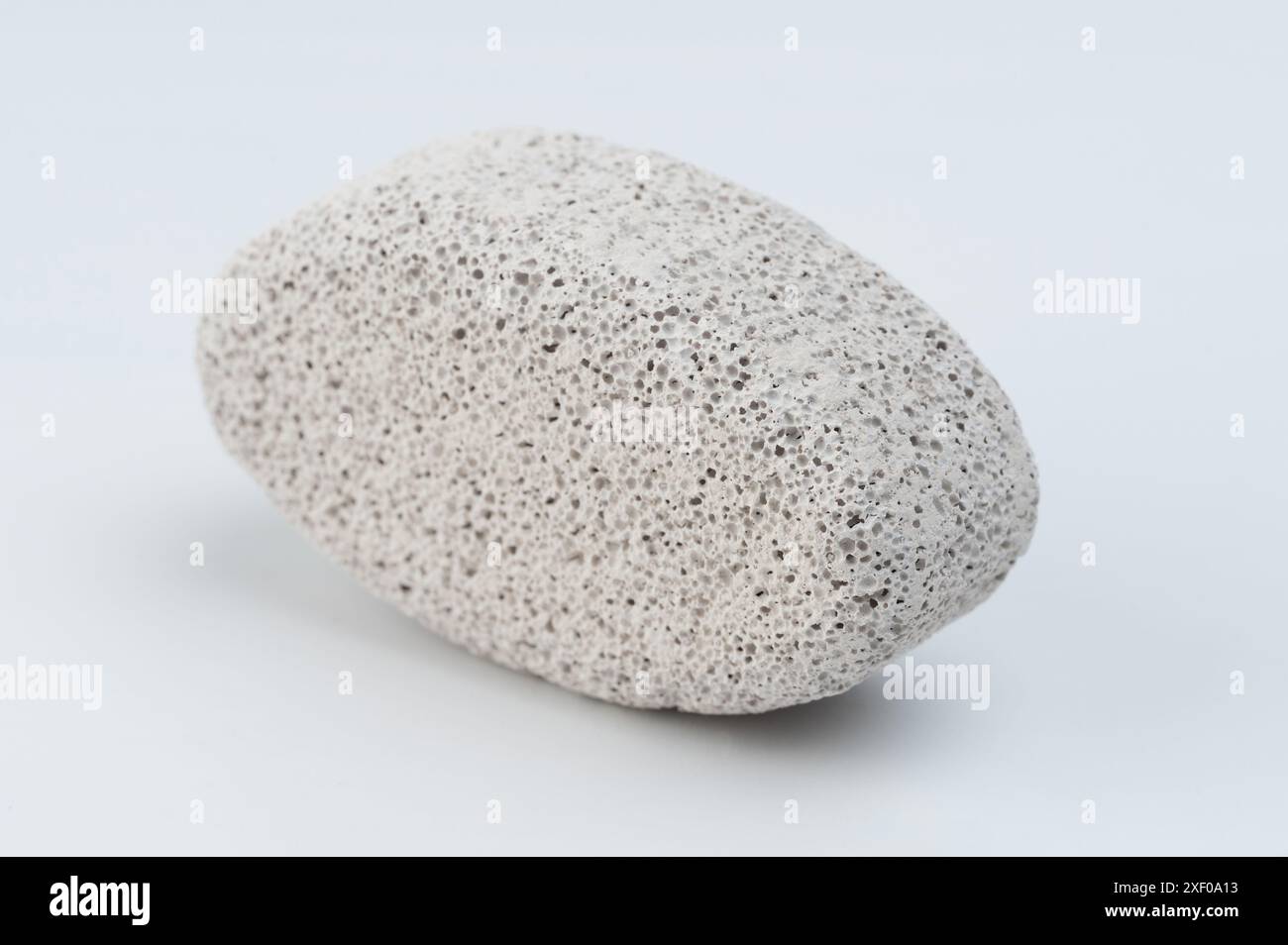 Pedicure stone with pores for scrub skin on heels isolated on white ...