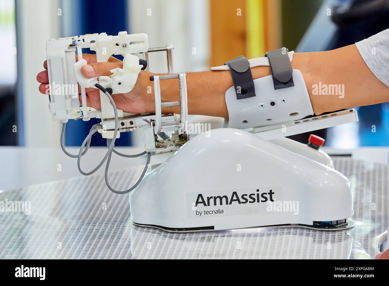 Patient with assistive robot for upper limb rehabilitation, The robot ...