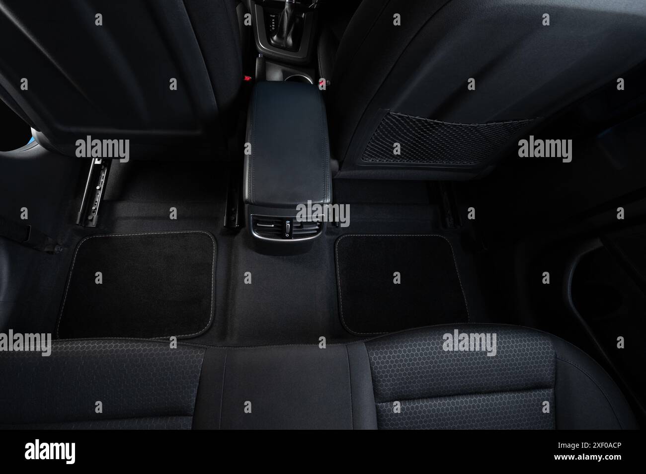 Legroom in car floor with black mats above top view Stock Photo - Alamy