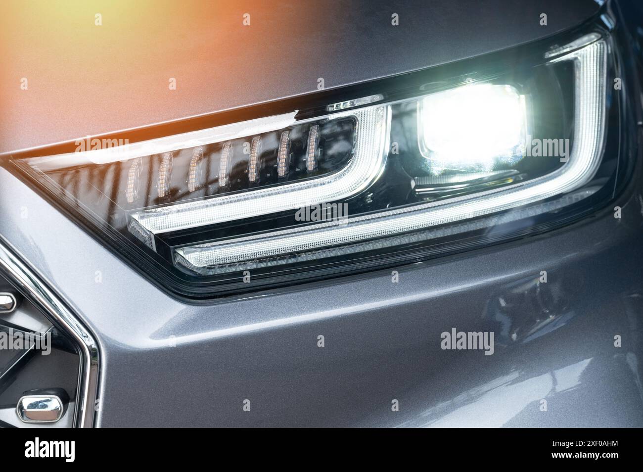 Led headlight on modern gray color car macro close up view Stock Photo ...