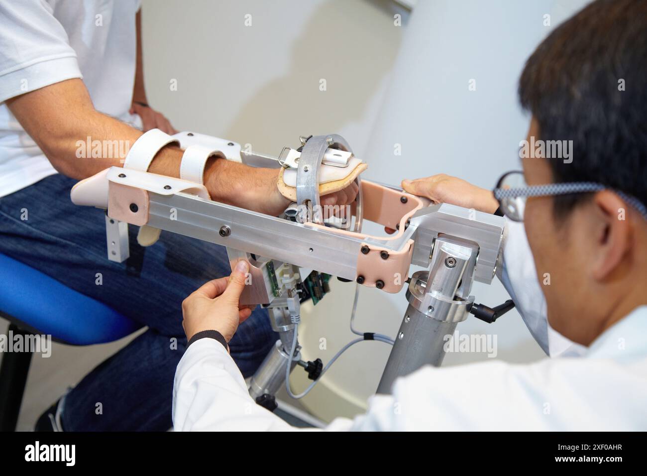 Researcher placing a patient clinical training device of the limb has ...