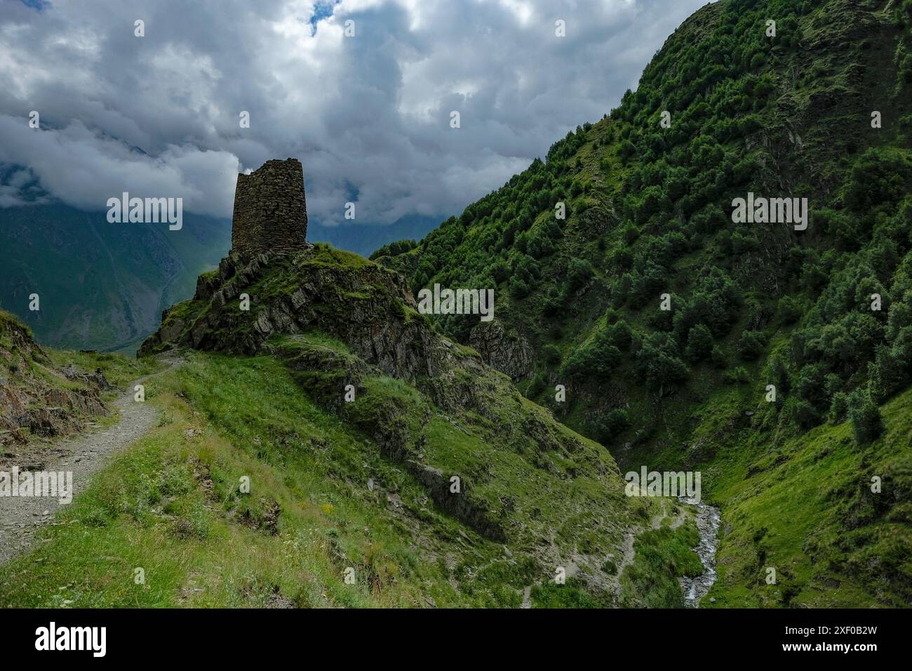 Stepantsminda, Georgia - June 30, 2024: Landscape with the ruins of the ...