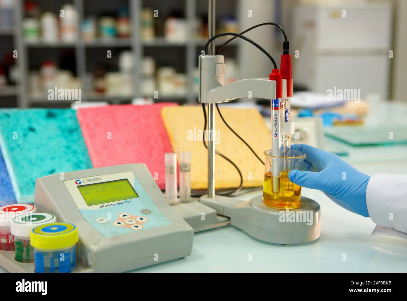 Selective electrode pH meter and samples of coloured cement for study ...