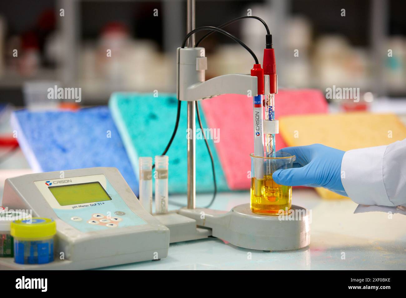 Selective electrode pH meter and samples of coloured cement for study ...