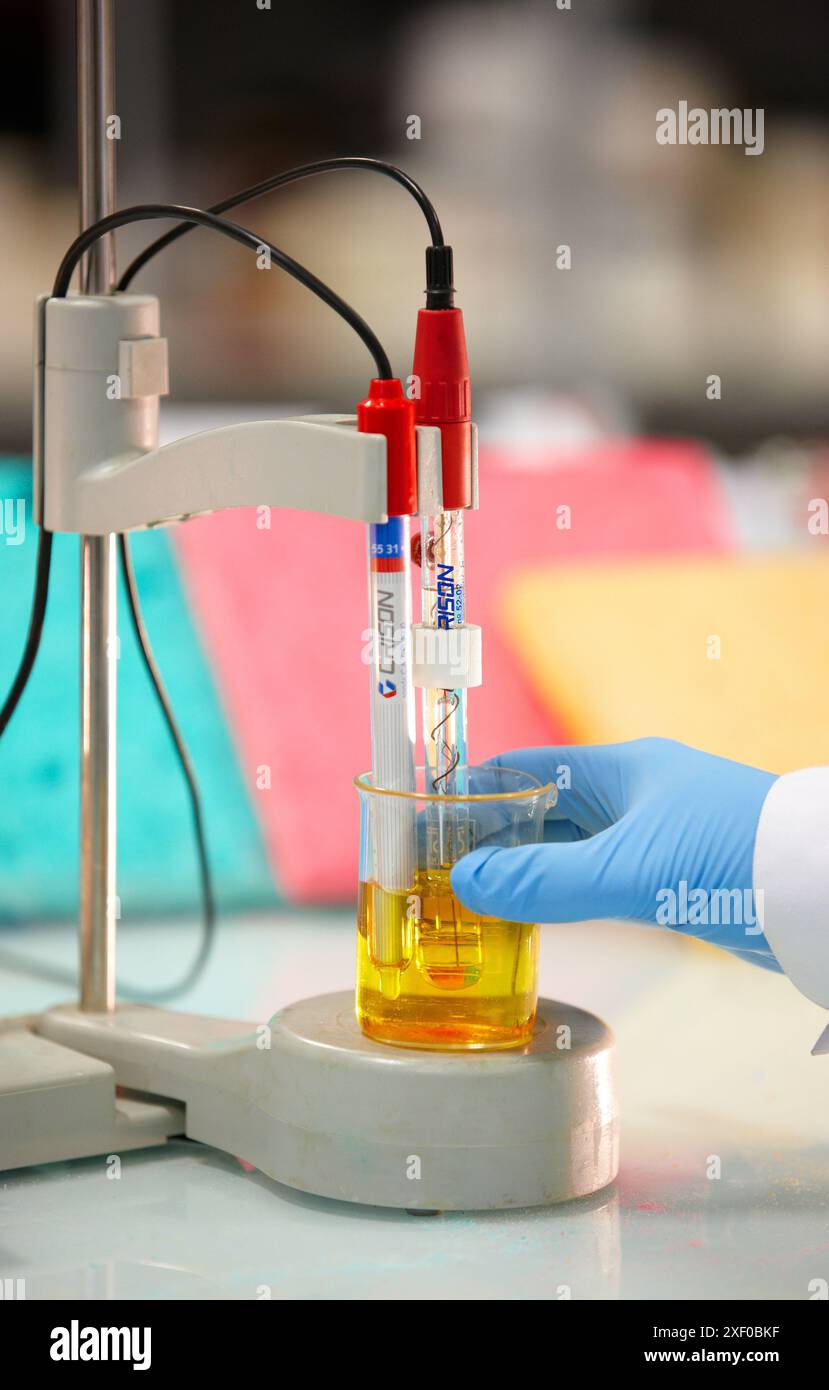 Selective electrode pH meter and samples of coloured cement for study ...