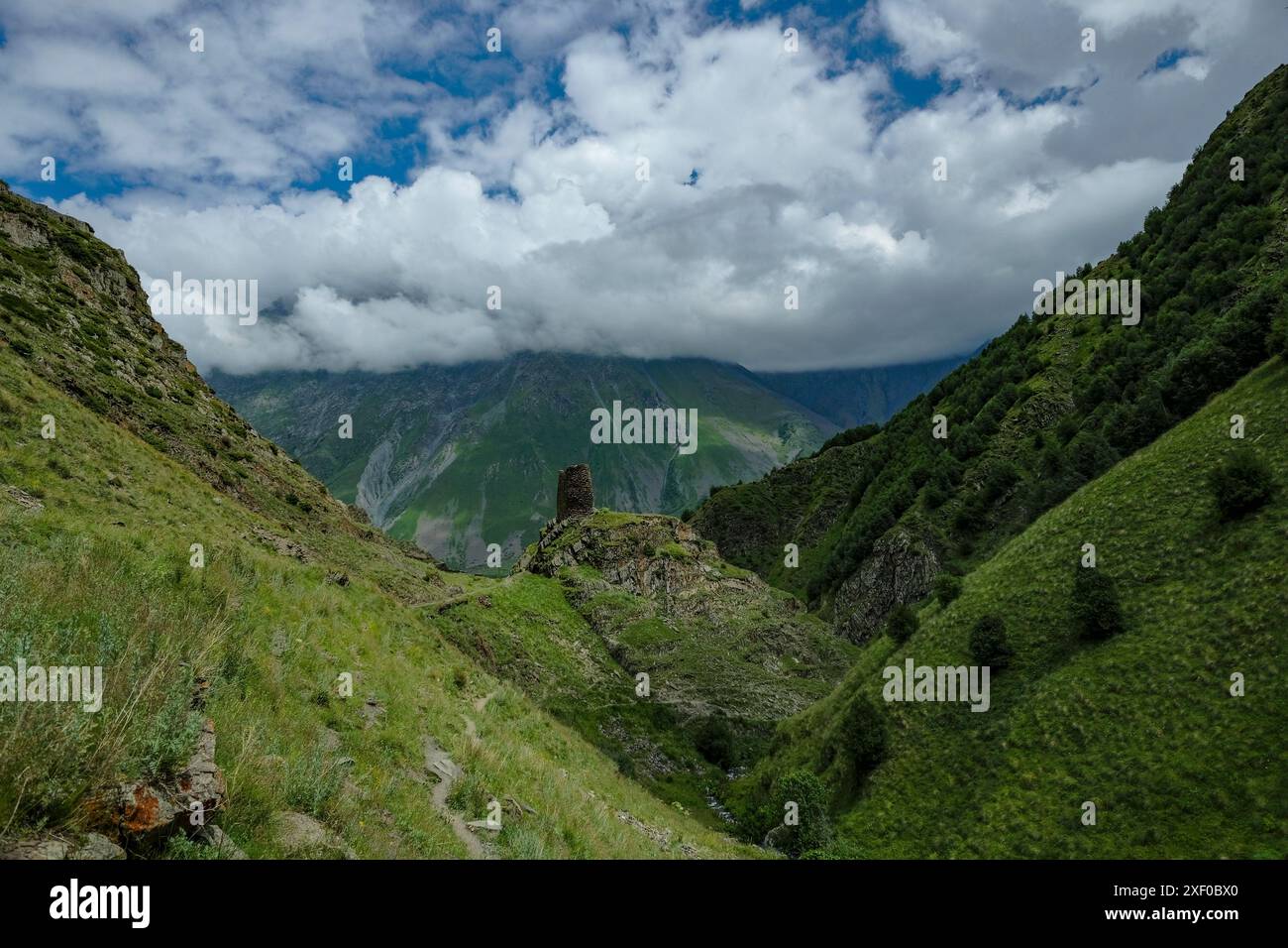 Stepantsminda, Georgia - June 30, 2024: Landscape with the ruins of the ...
