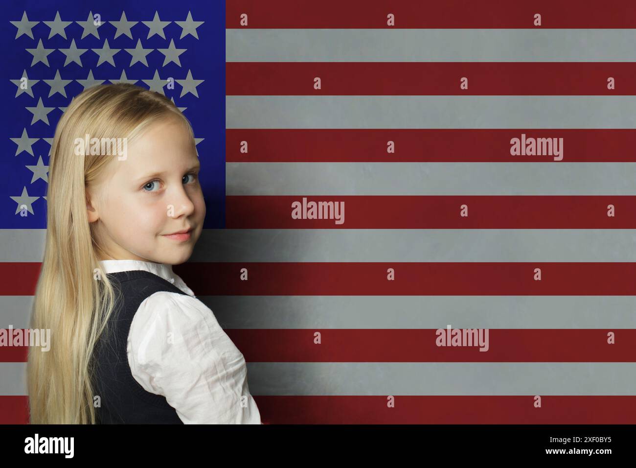 Happy young child girl student in front of USA flag background, US ...