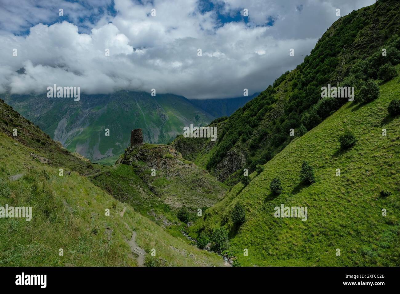 Stepantsminda, Georgia - June 30, 2024: Landscape with the ruins of the ...