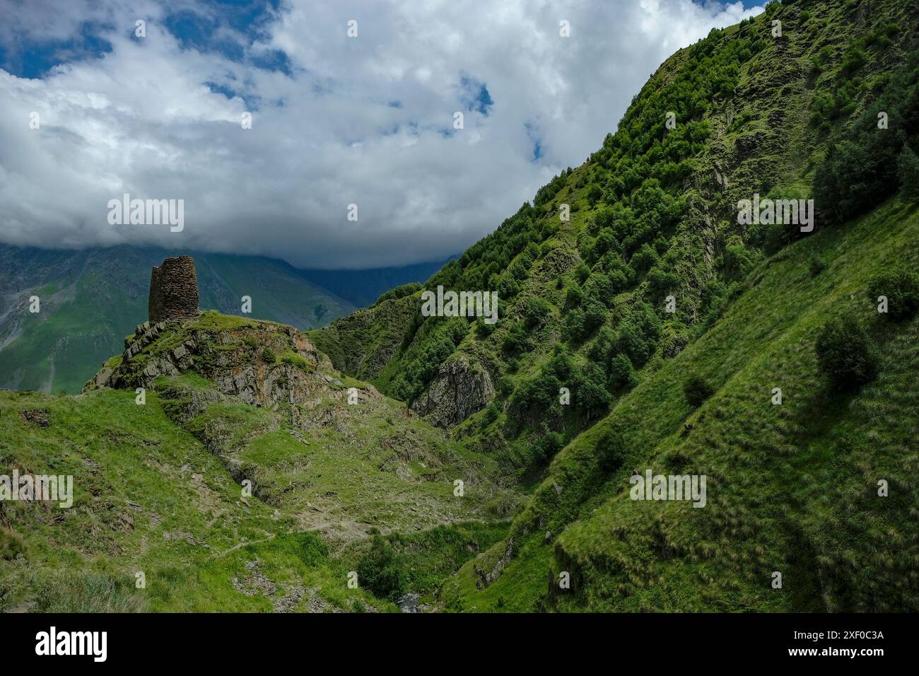 Stepantsminda, Georgia - June 30, 2024: Landscape with the ruins of the ...